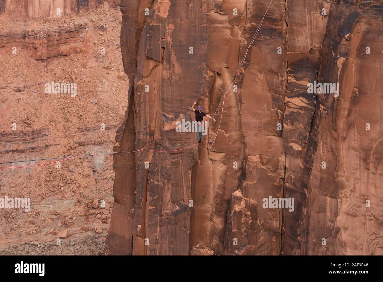 A young man slacklining or highlining hundreds of feet above Mineral ...