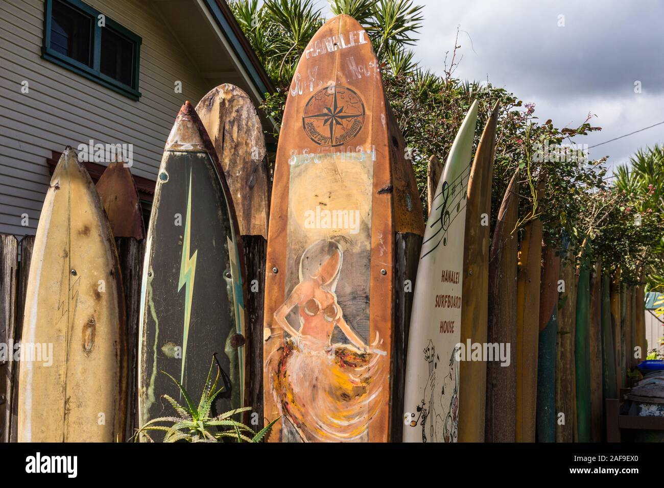 A painted surfboard sign and surfboard fence at a bed and breakfast in ...