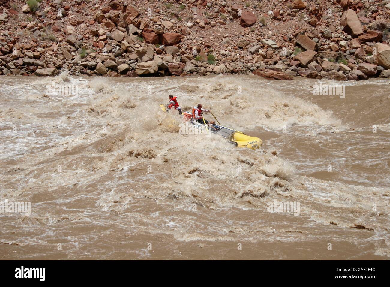 An 18' rowing raft navigates through the Big Drop II rapid in Cataract ...