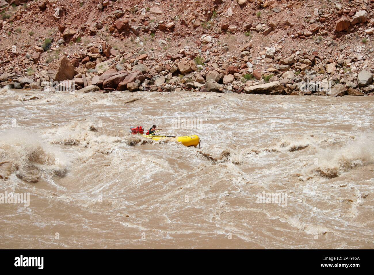 An 18' rowing raft navigates through the Big Drop II rapid in Cataract ...