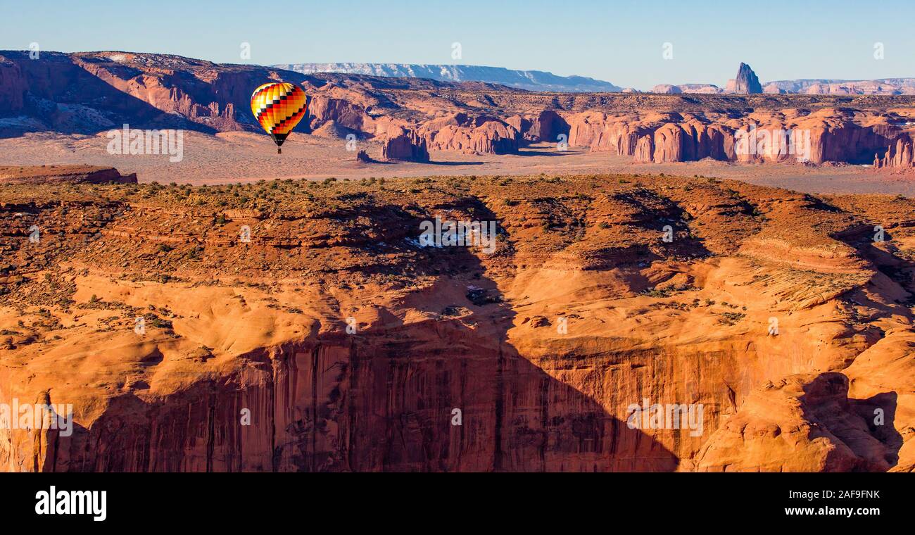 An aerial view of a hot air balloon flying over Rain God Mesa in the ...