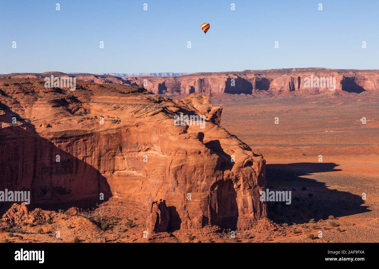 An aerial view of a hot air balloon over Rain God Mesa in the Monument ...