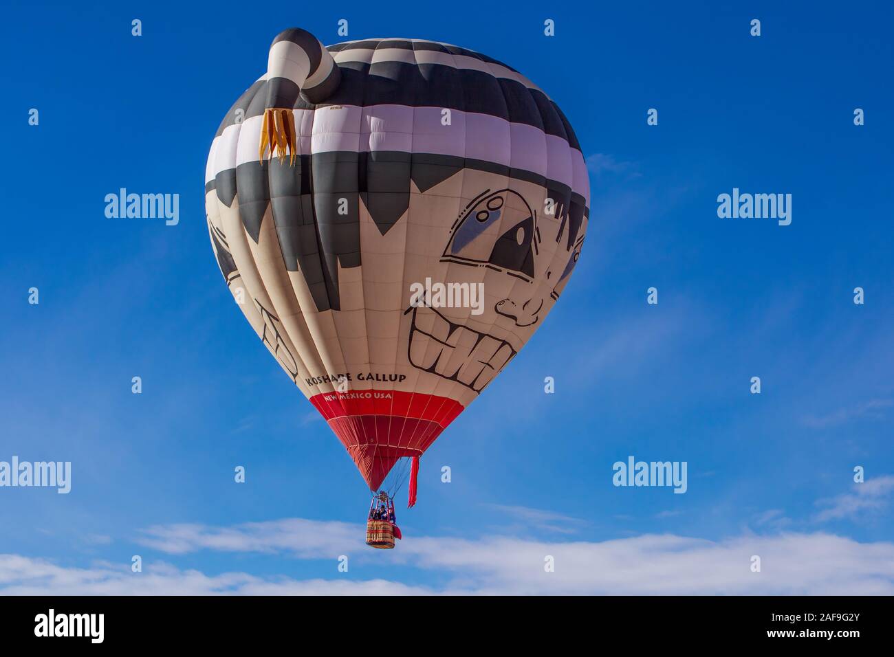 Telephoto view of a hot air balloon in the shape of a Hopi Kachina ...
