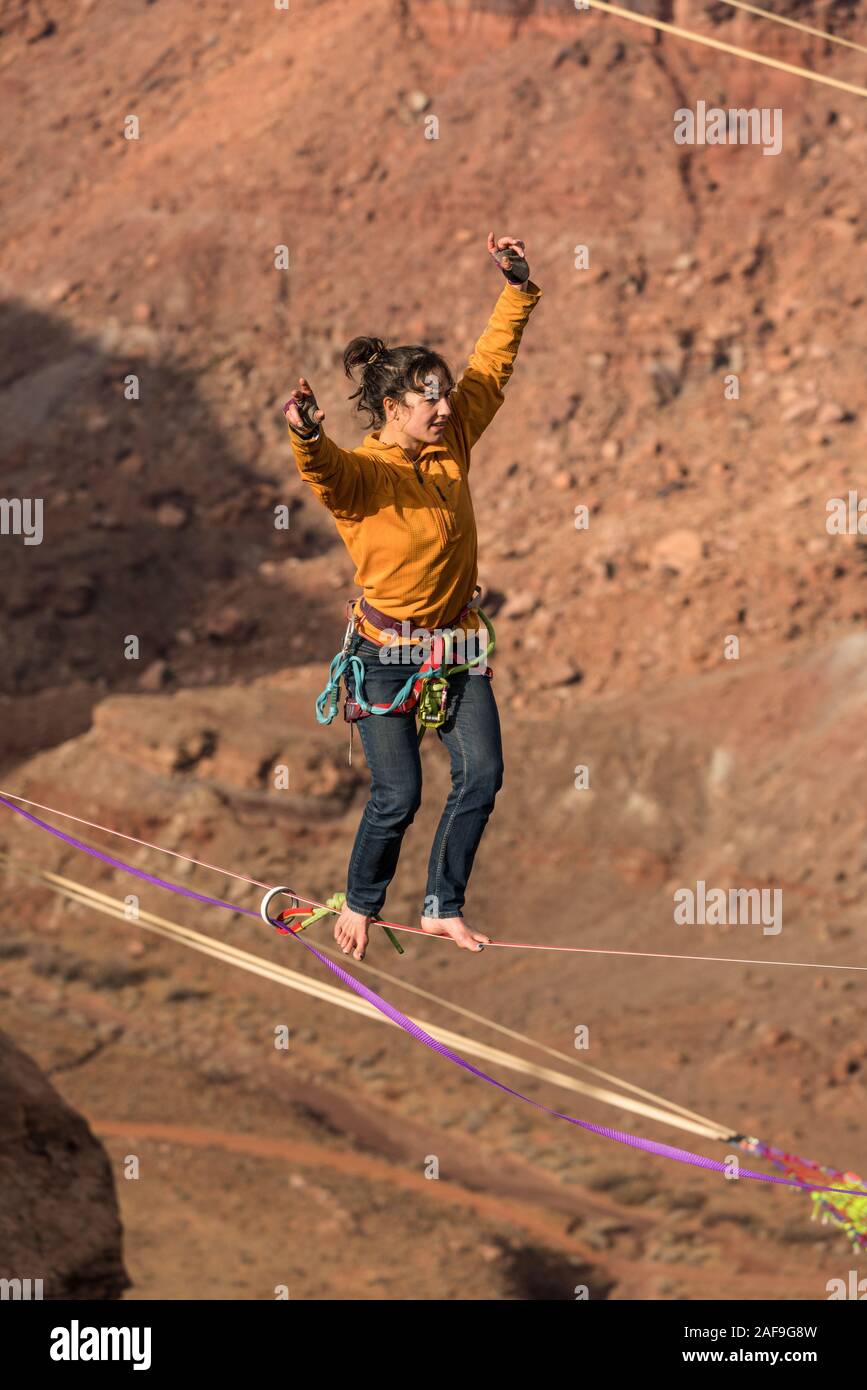 A young woman slacklining or highlining hundreds of feet above Mineral ...