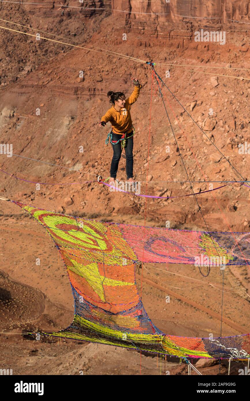 A young woman slacklining or highlining hundreds of feet above Mineral ...