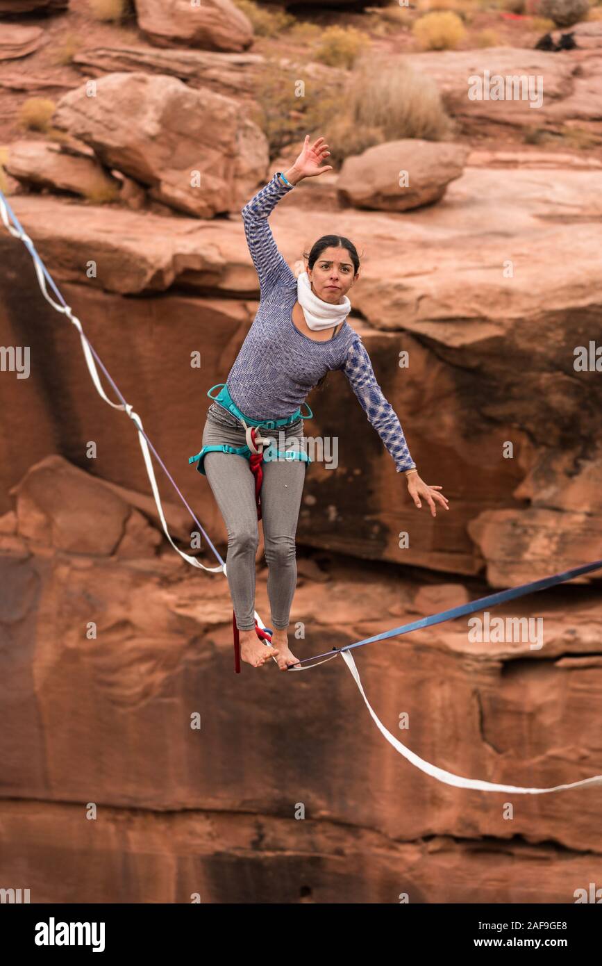 A young woman slacklining or highlining hundreds of feet above Mineral ...