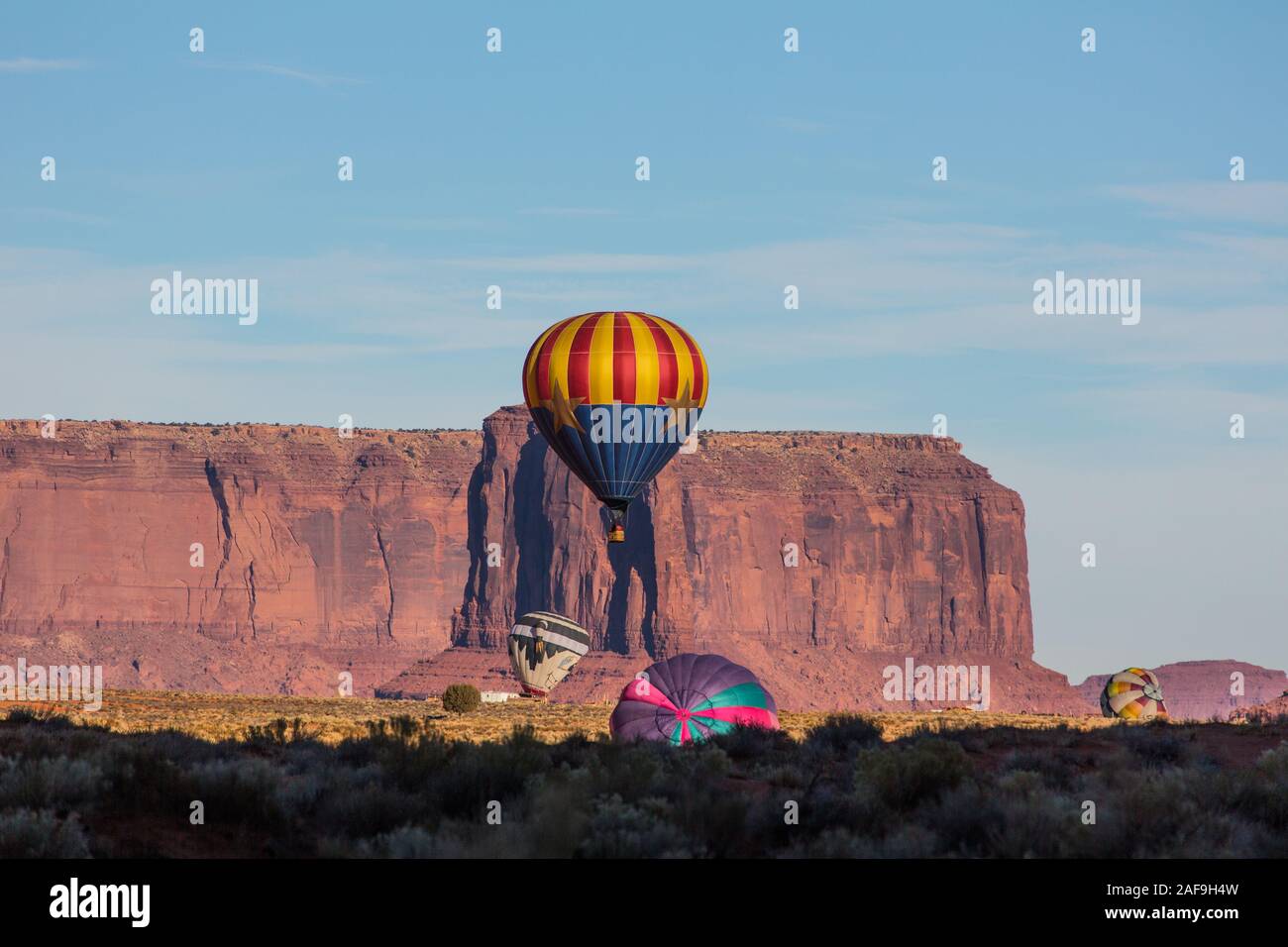 Four hot air balloons launch in front of the West Mitten and Sentinal ...
