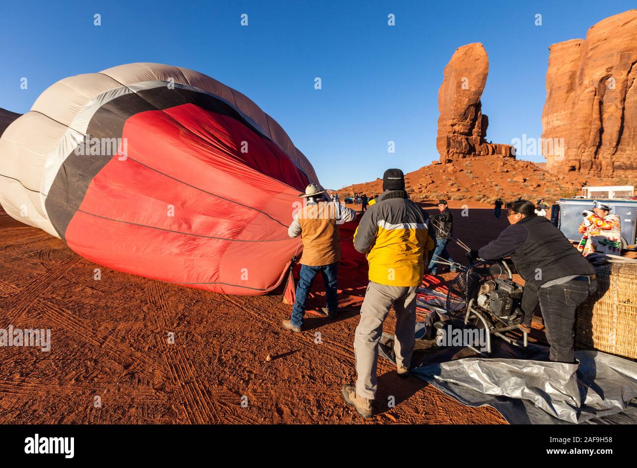 A team inflates a hot balloon in preparation for launch in the Monument ...