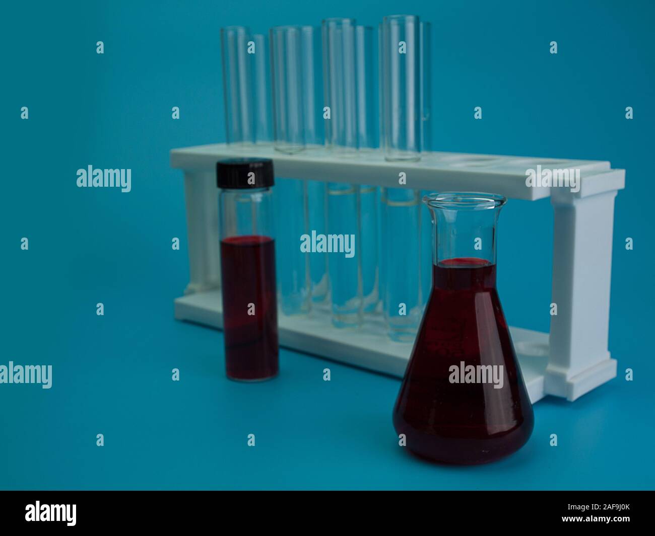 experimentation ,laboratory test tube , Blue background Stock Photo - Alamy