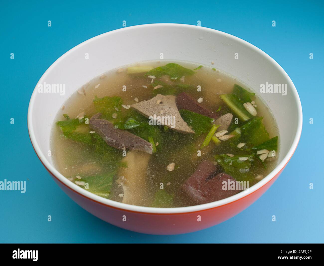 Boiled offal , Put them in a bowl ,Placed on a black background Stock ...