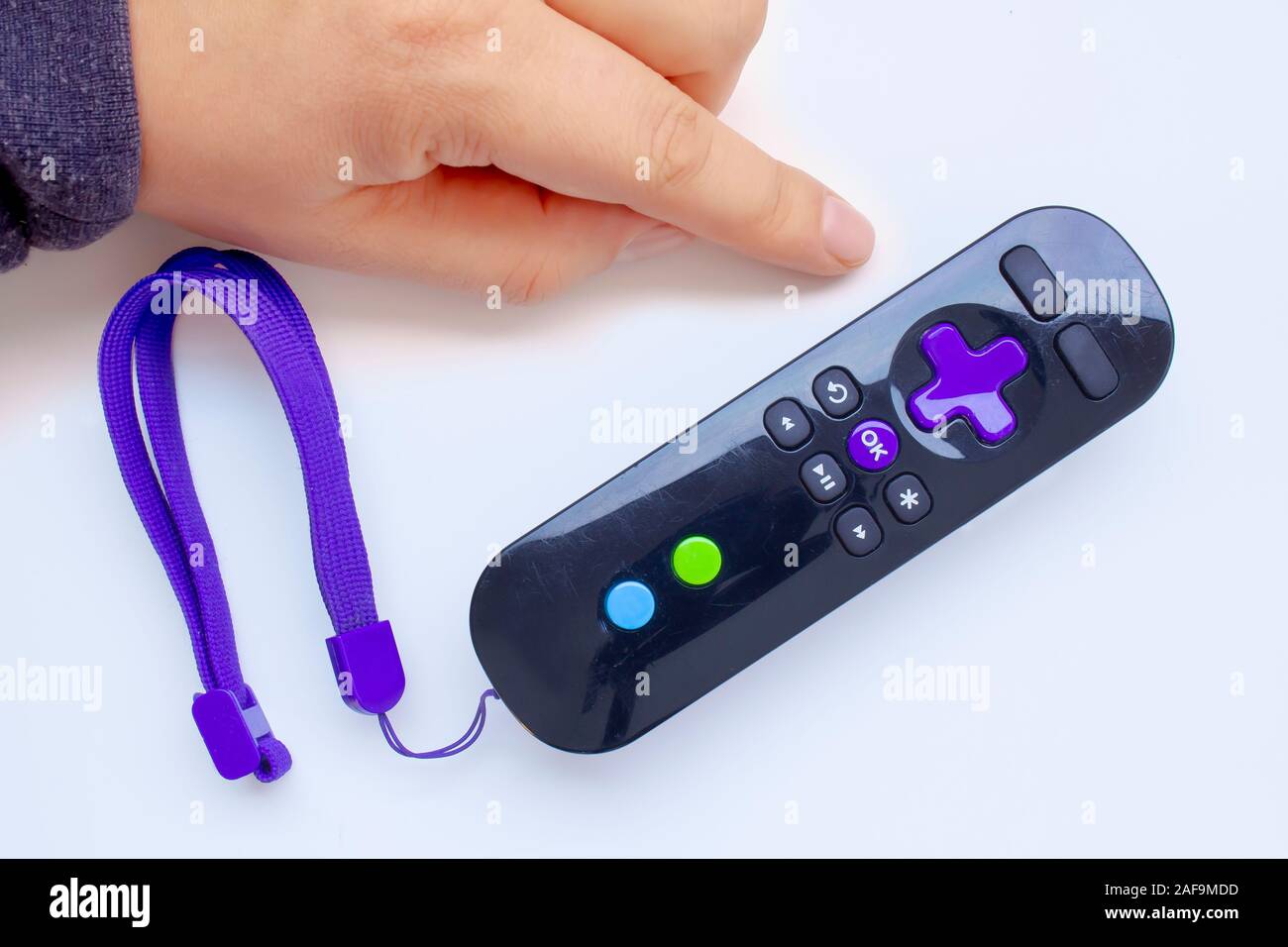 Online media player remote control with a hand Stock Photo - Alamy