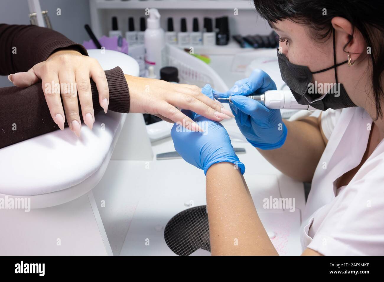 Manicurist drawing on nail close hi-res stock photography and images ...