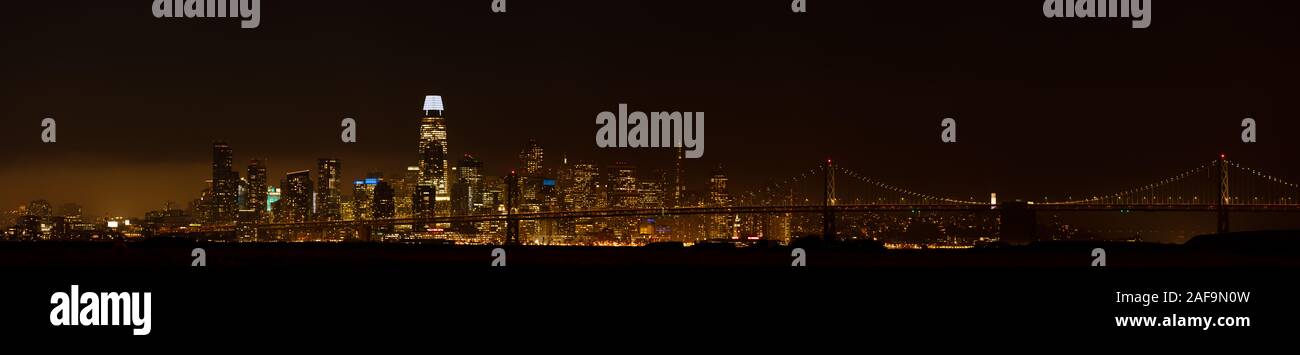 San Francisco skyline and Bay Bridge at night from Alameda, California ...