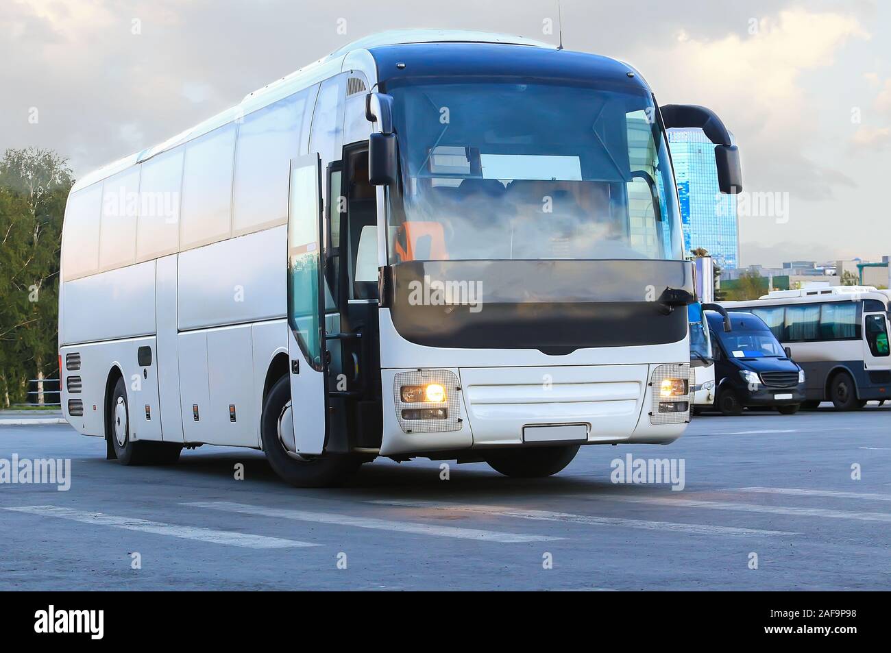 big tourist buses on parking Stock Photo - Alamy