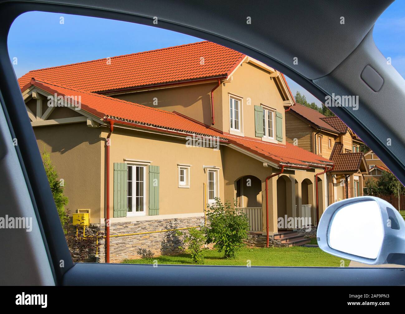 new modern cottage from car window Stock Photo - Alamy