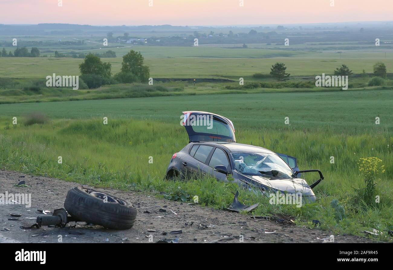 broken by car after accident in field at road Stock Photo - Alamy