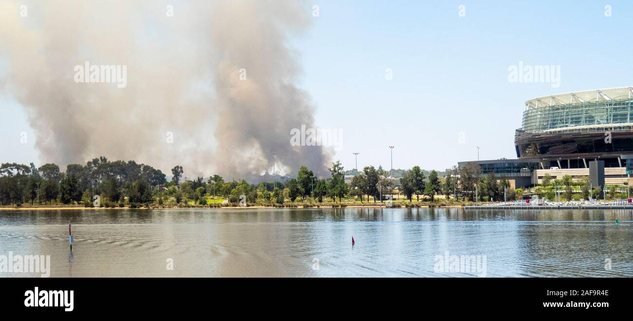 Smoke from a bushfire in Belmont alongside the Swan River near Optus ...