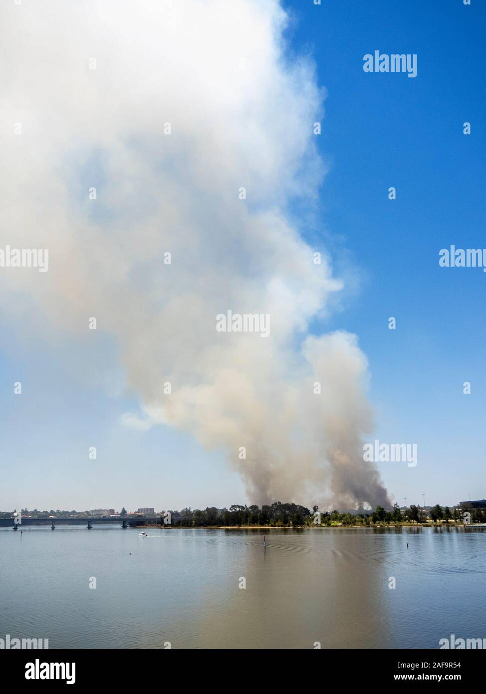 Smoke from a bushfire in Belmont alongside the Swan River Perth Western ...