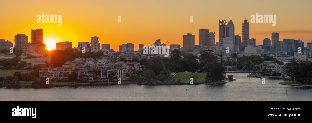 Sunset over Perth city towers and skyscrapers skyline and entrance to ...