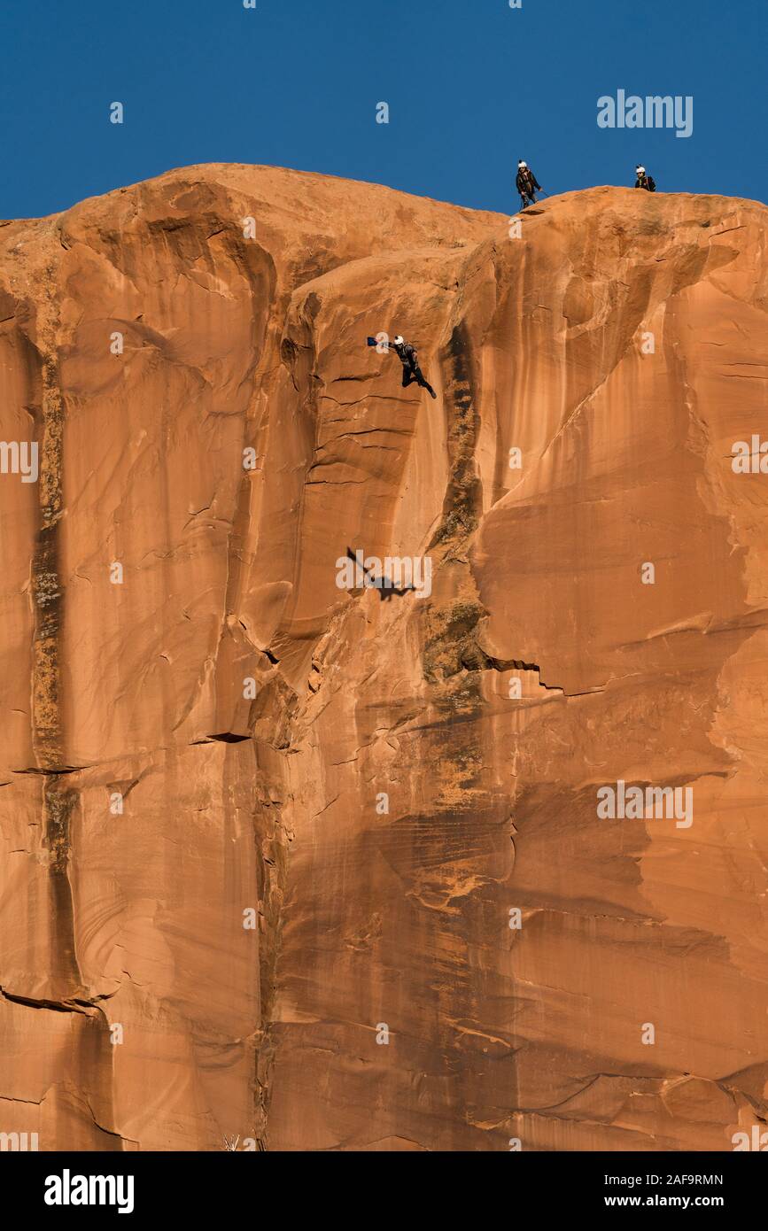 A BASE jumper leaps off the 400 foot vertical face of the Tombstone in ...