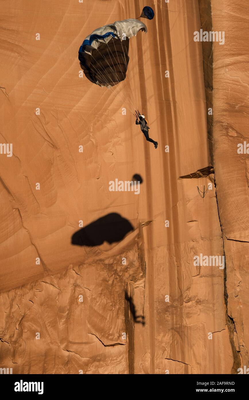 A BASE jumper descends off the 400 foot vertical face of the Tombstone ...