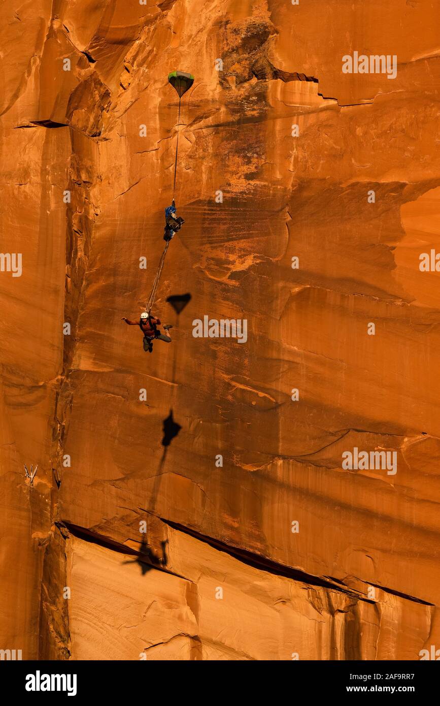 A BASE jumper leaps off the 400 foot vertical face of the Tombstone in ...