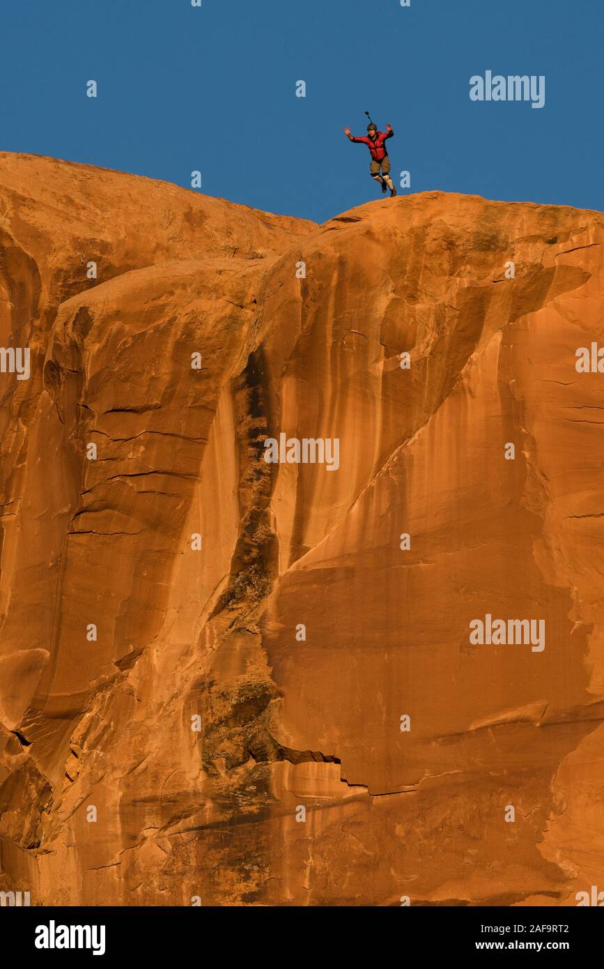 A BASE jumper leaps off the top of the 400 foot vertical face of the ...