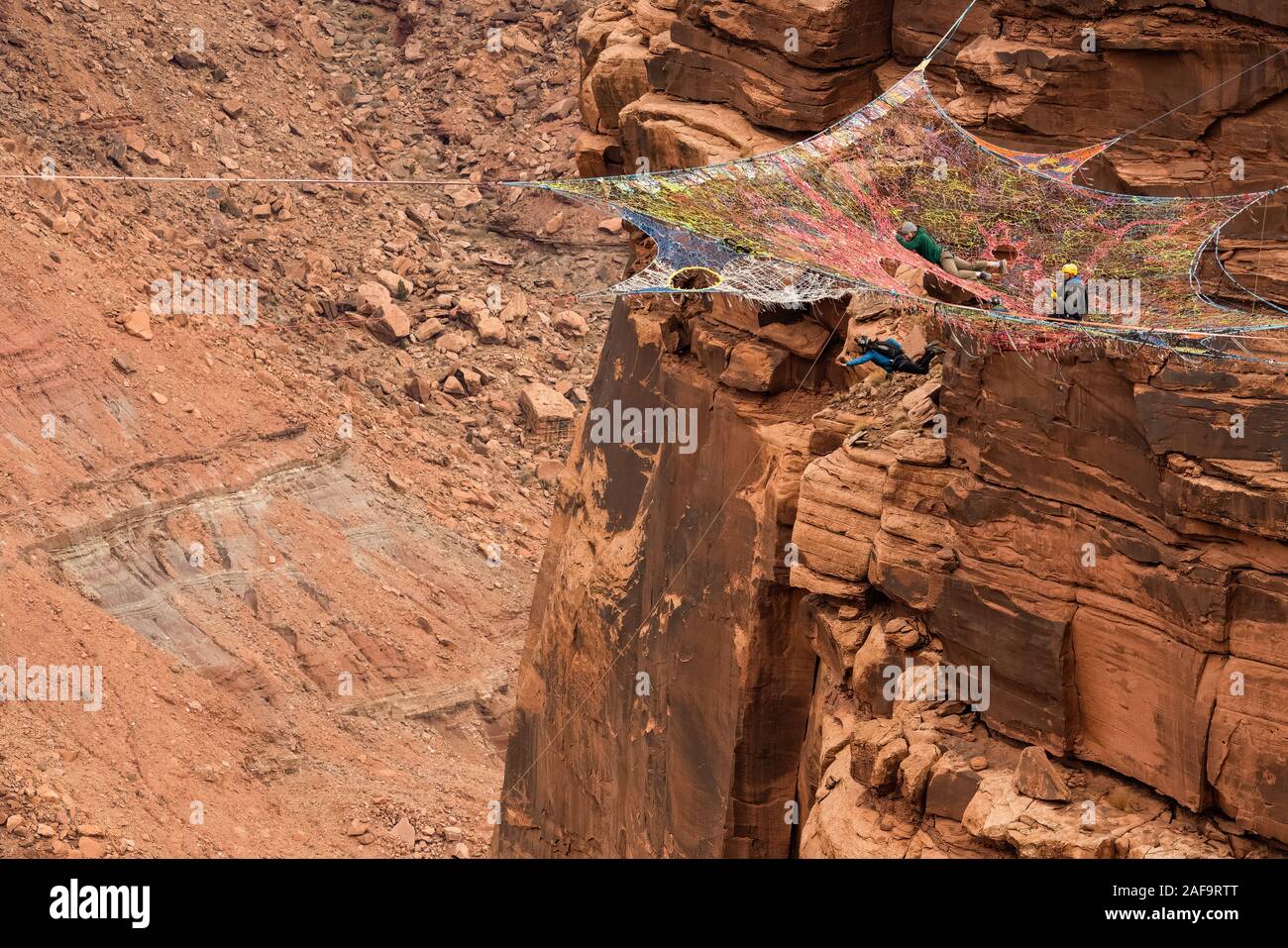 A female BASE jumper leaps from the Mothership Space Net suspended from ...