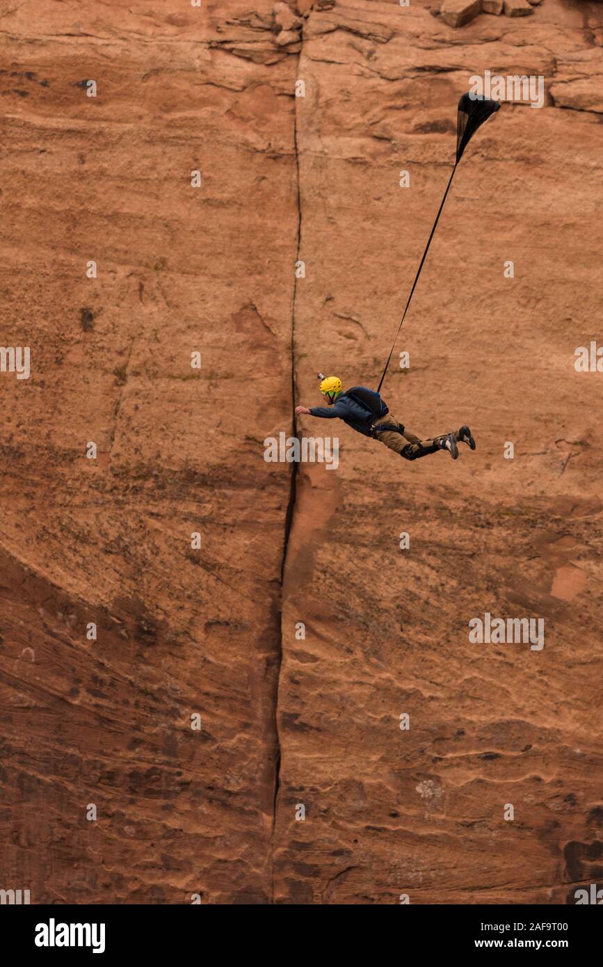 A BASE jumper free-falls from the clifftop 950 vertical feet above the ...