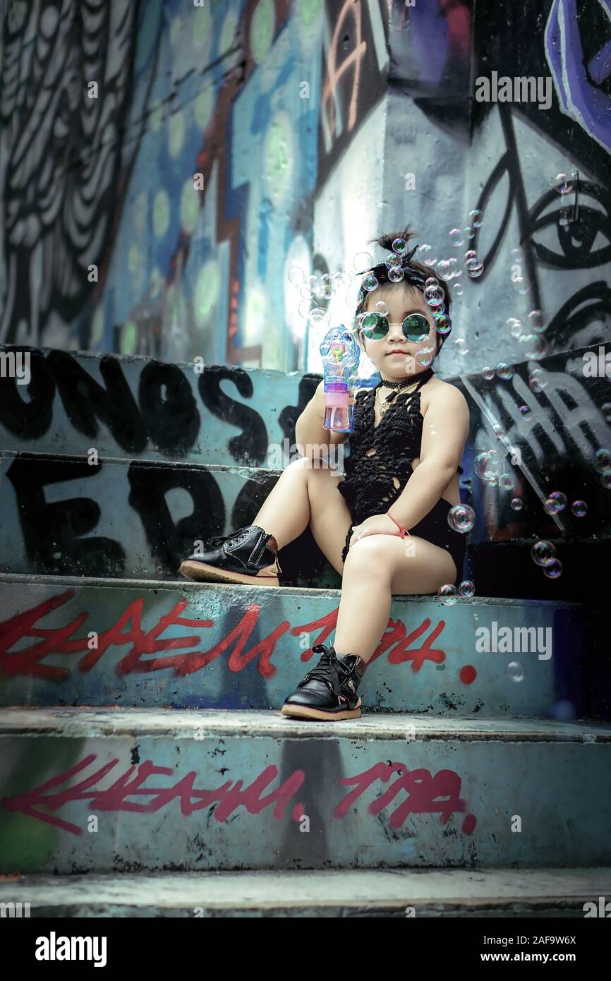 The little Girl at graffiti park Outdoor Stock Photo - Alamy