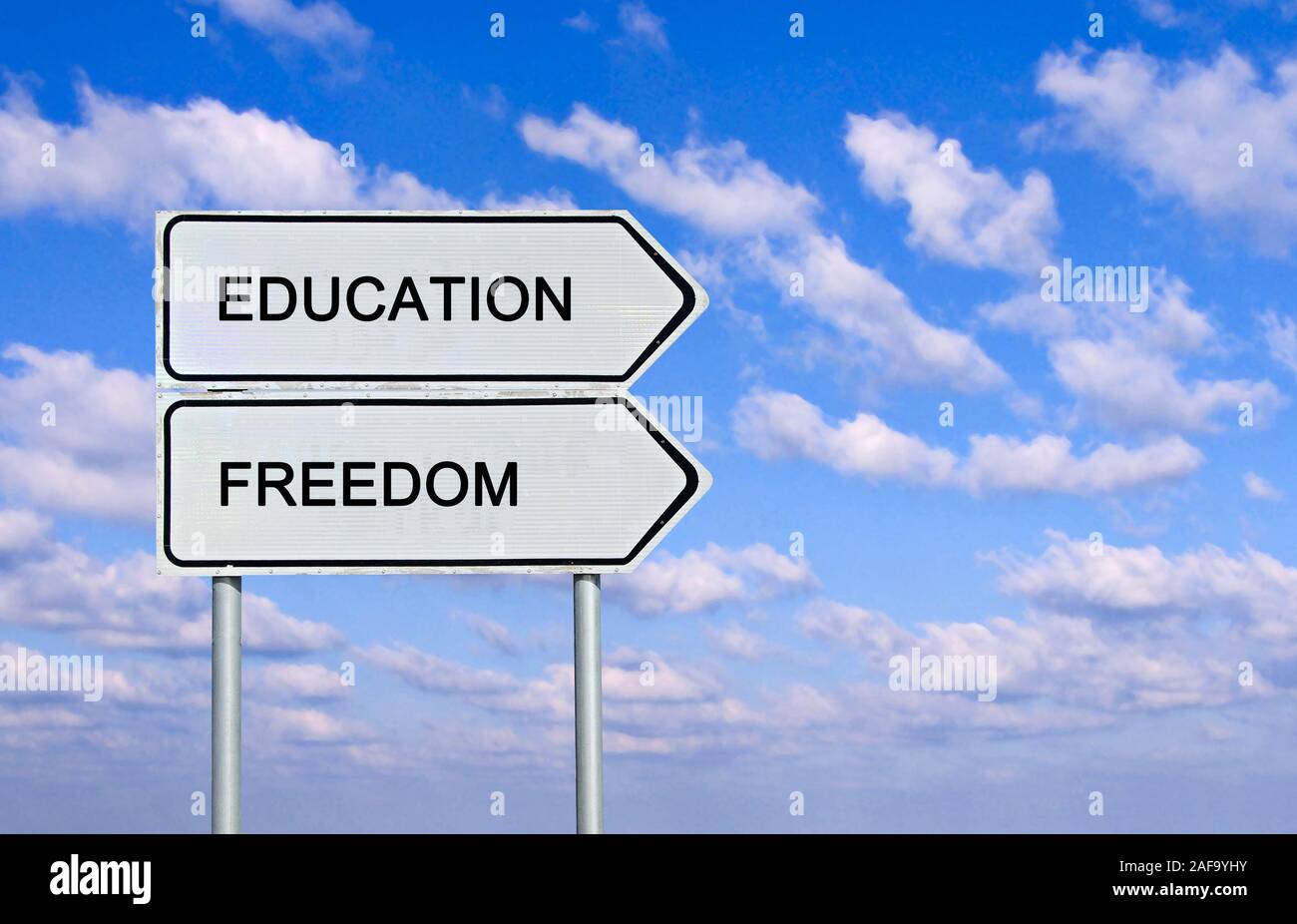 Road sign to education and freedom Stock Photo - Alamy