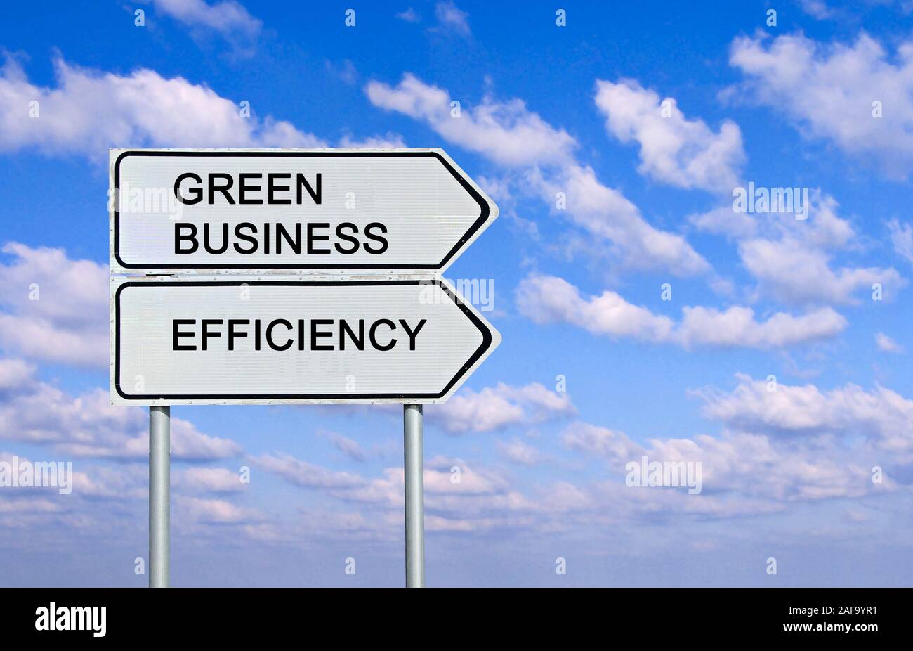 Road sign to green business and efficiency Stock Photo - Alamy