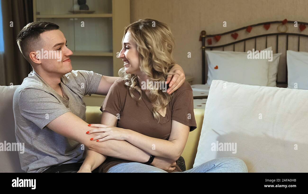 Couple flirting on sofa hi-res stock photography and images - Alamy