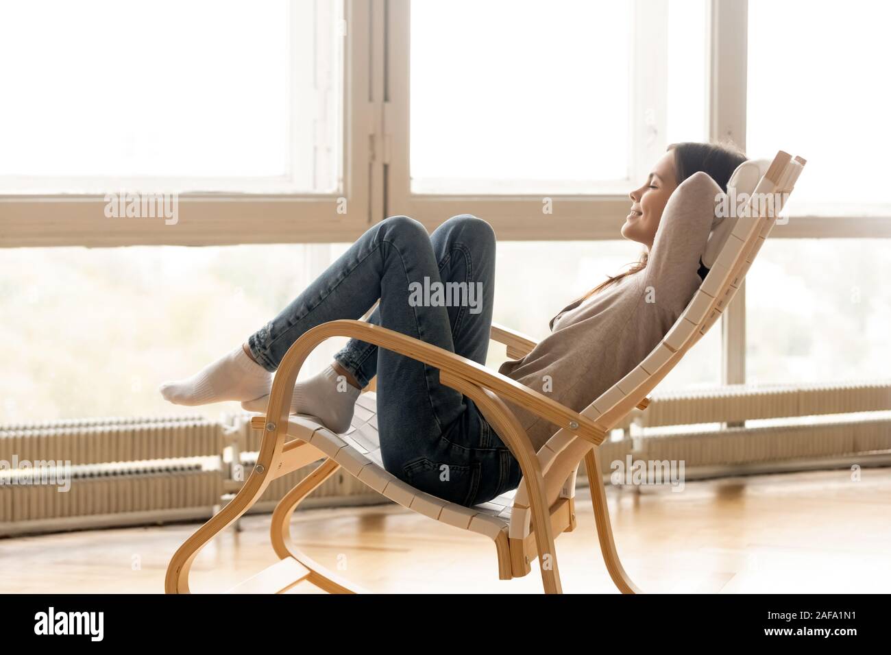 Girl sitting in rocking chair hi-res stock photography and images - Alamy