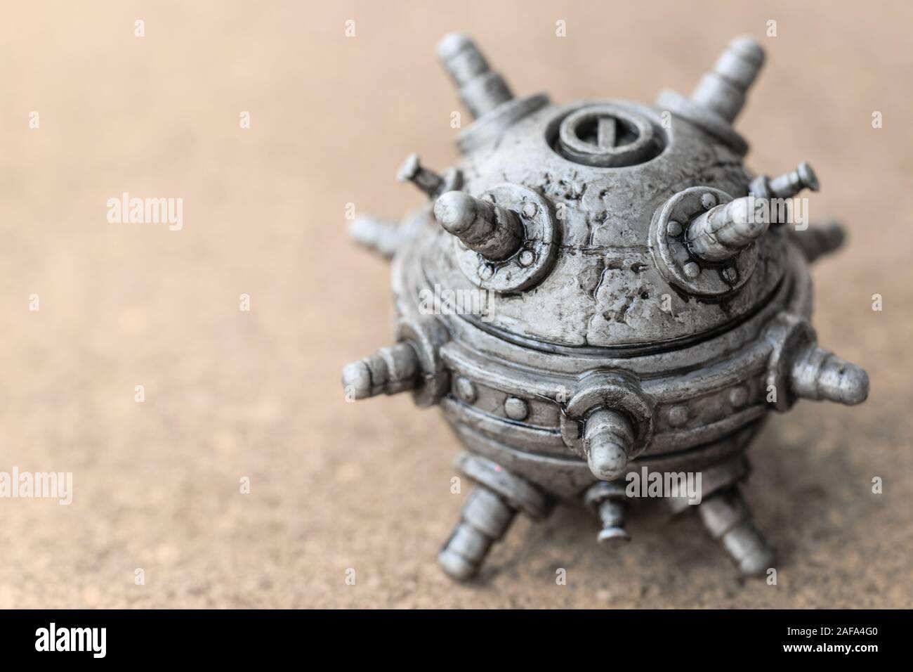 silver color plastic mine toy on the sands Stock Photo - Alamy