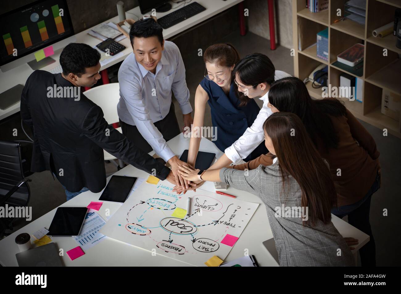 Group of Asian team creative business people join hands partnership ...