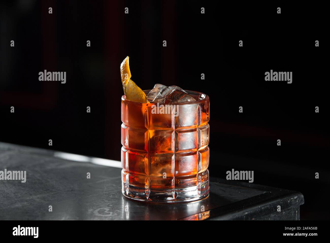 Boulevardie cocktail on a bar desk. black background Stock Photo - Alamy