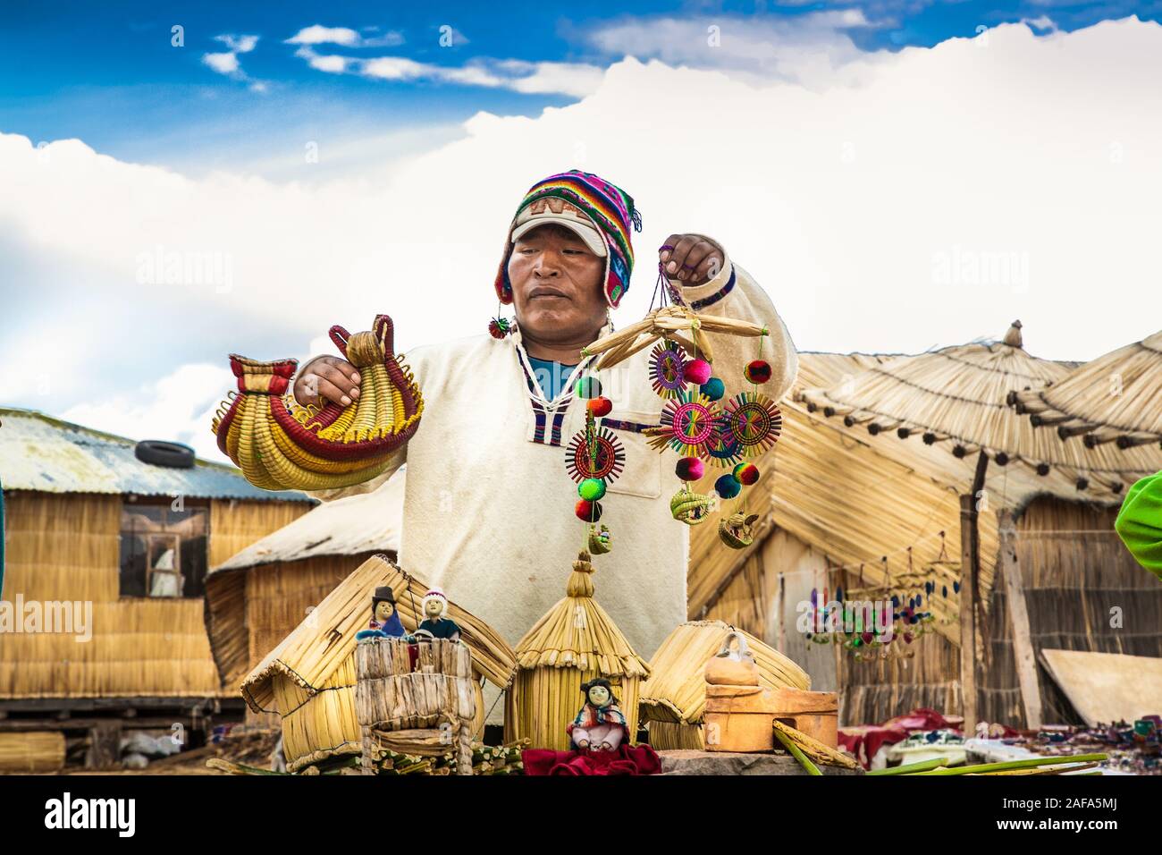 Uros, Peru- Jan 5, 2019: Inhabitants of Uros floating islands sell the ...