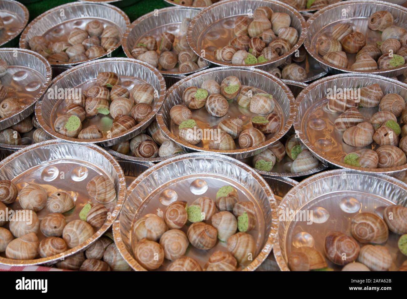 Snails for sale at a street food vendors stall in Paris, France Stock ...