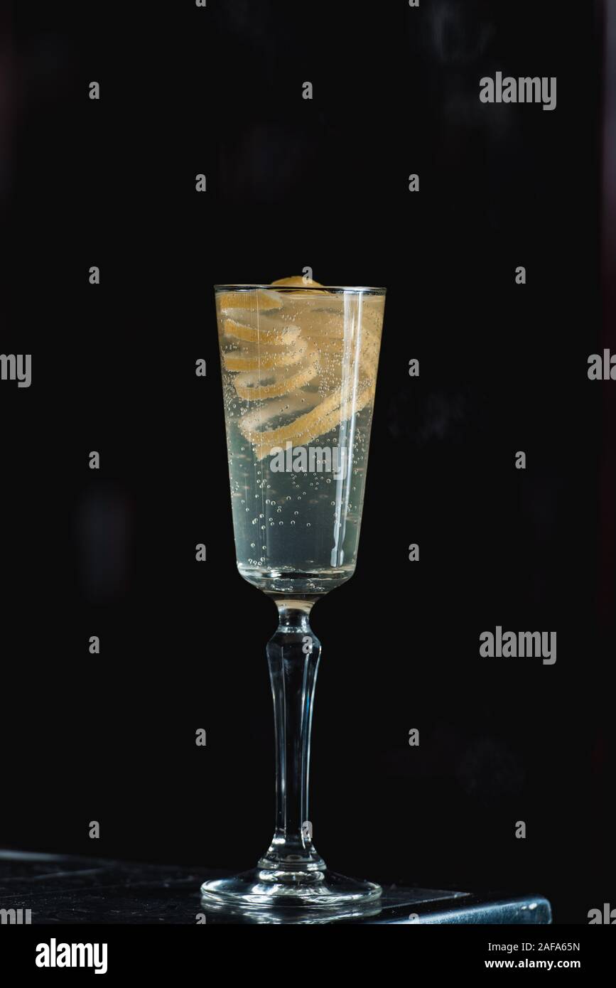 French 75 Alcoholic Cocktail garnish with a long ribbon of lemon peel ...