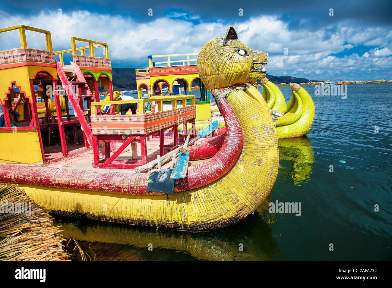 Uros, Peru - Jan 5, 2019. Traditional Totora boat with tourists on ...