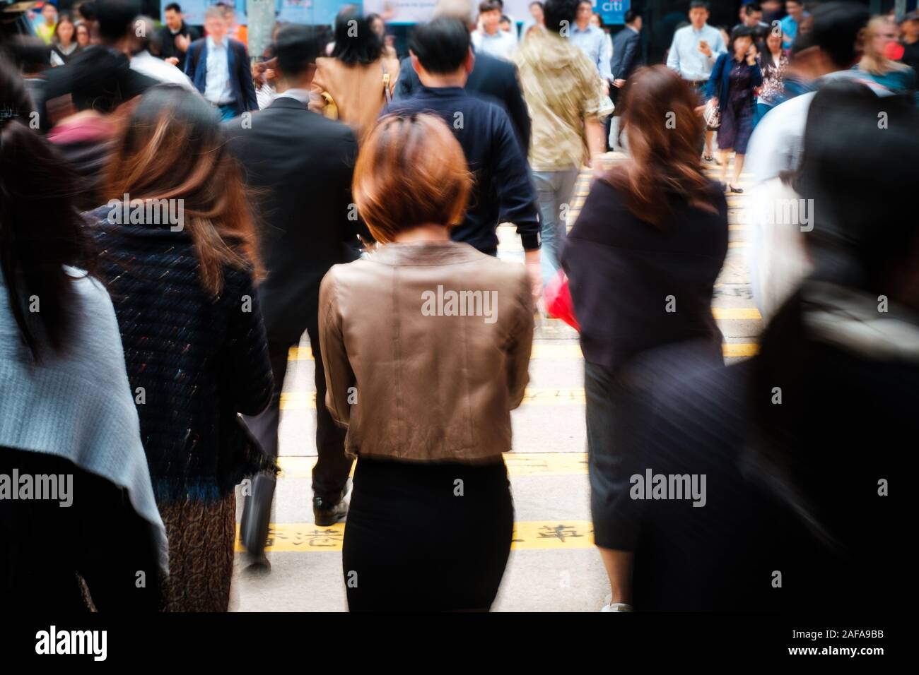 Asian woman walking behind street hi-res stock photography and images ...