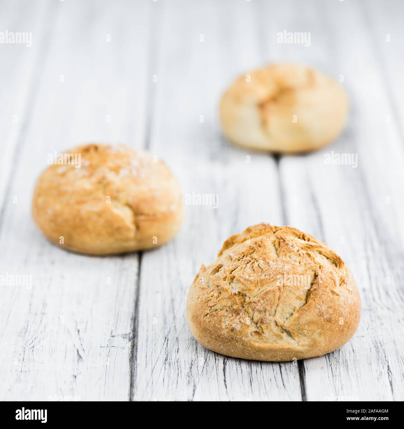 Fresh made German Buns on a vintage background as detailed close-up ...