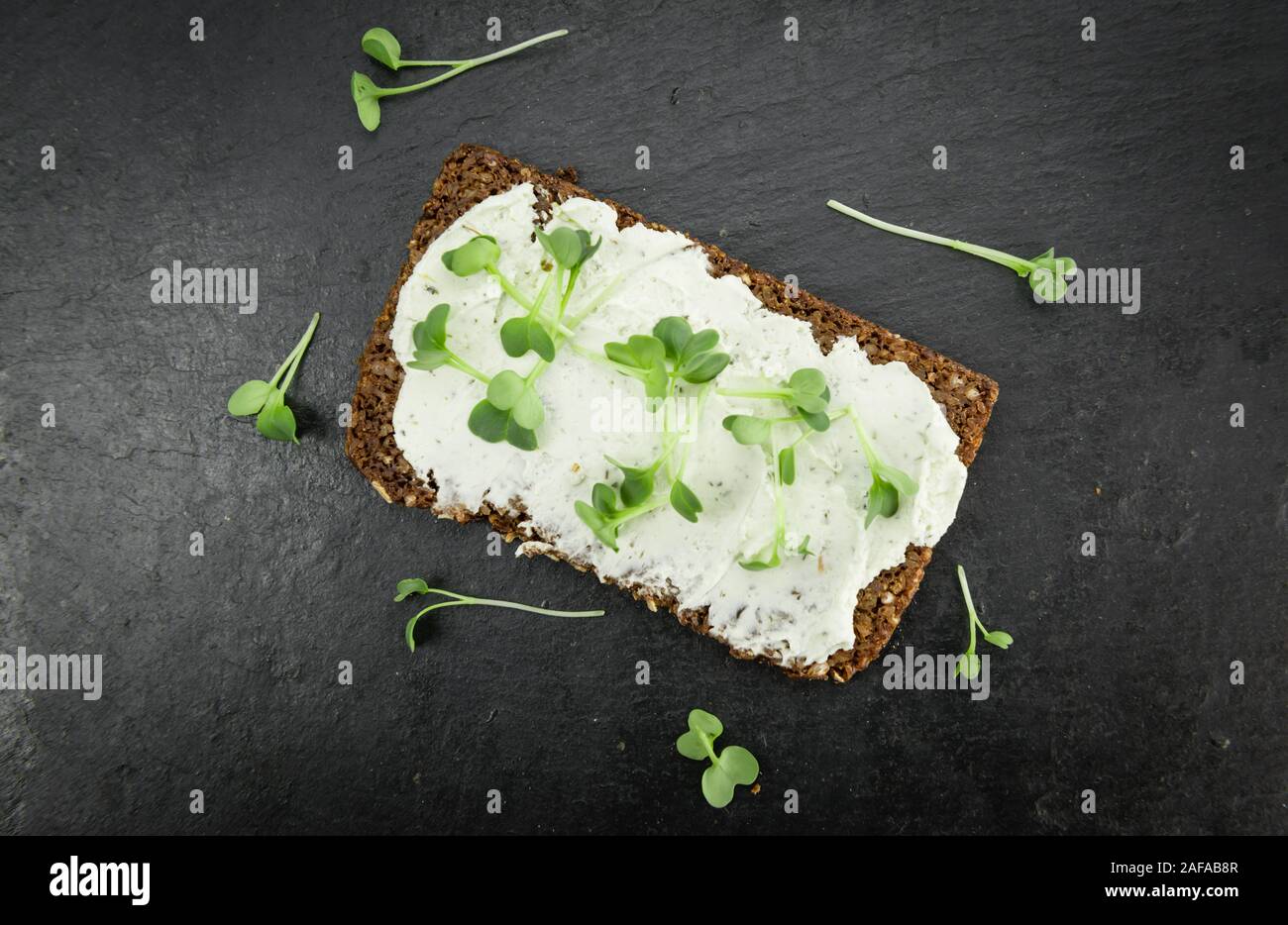 Fresh cutted Cress with creamy Cheese on a slice of bread (selective ...