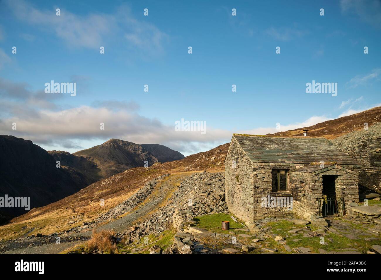 Autumn Fall landscape image of old bothy in Lake Districtr mountains ...