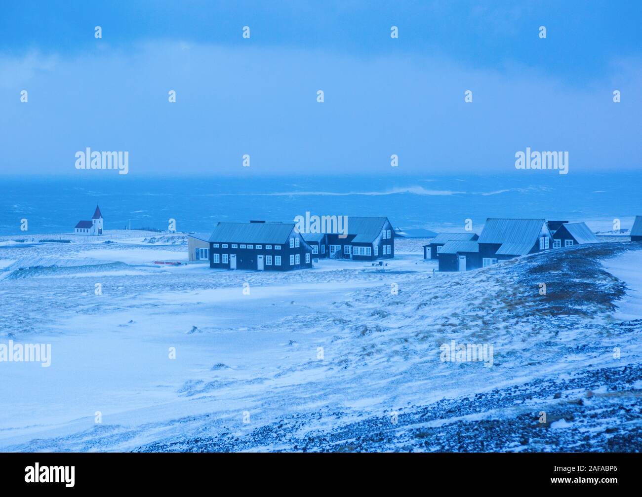 Small Icelandic village (near Olafsvik) by the ocean during the winter ...
