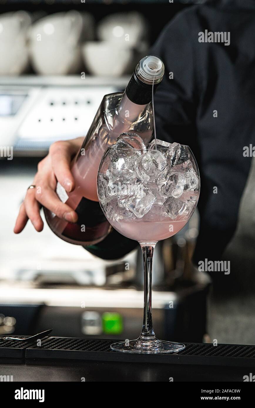 refreshing ruby red coctail with grape fruit isolated on a bar ...