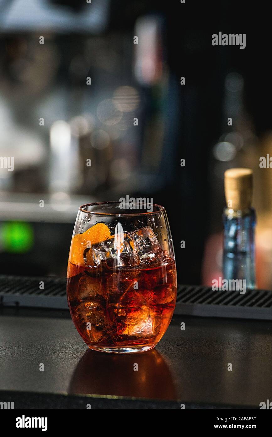 refreshing ruby red coctail with grape fruit isolated on a bar ...