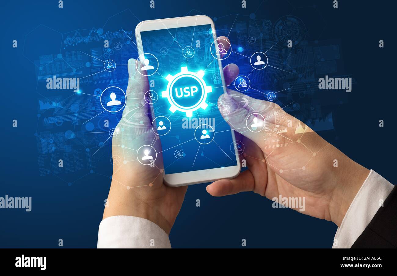 Female hand holding smartphone with USP abbreviation, modern technology ...