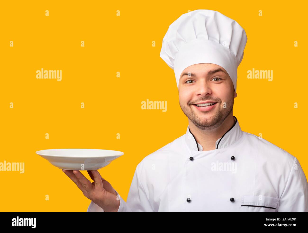 Chef Man Serving Dish Holding Empty Plate Over Yellow Background Stock ...